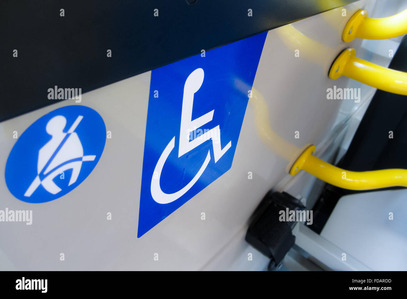 reserved seat label onboard bus for disabled people Stock Photo - Alamy