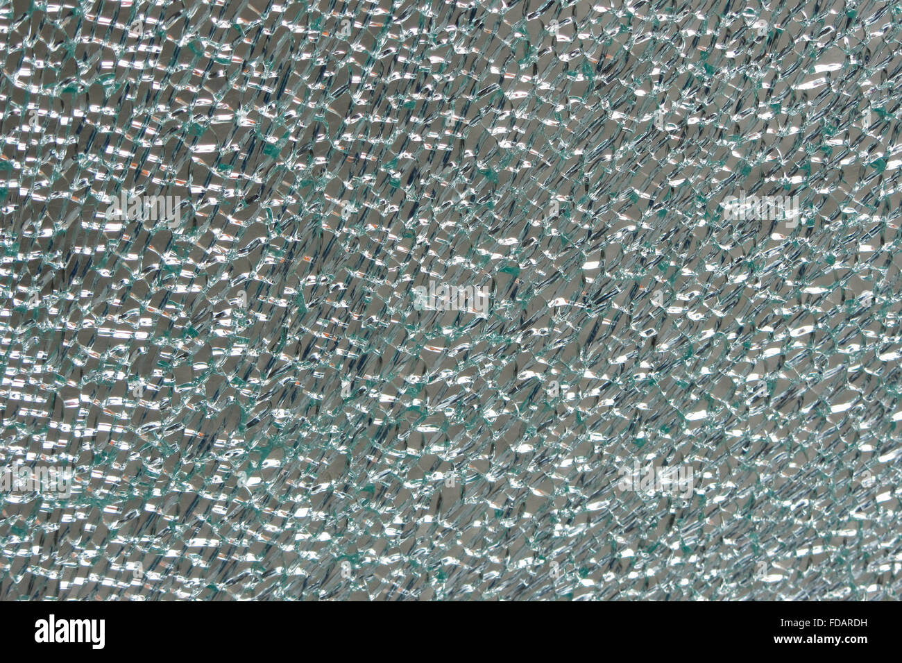 unbreakable glass damaged by crash texture Stock Photo - Alamy