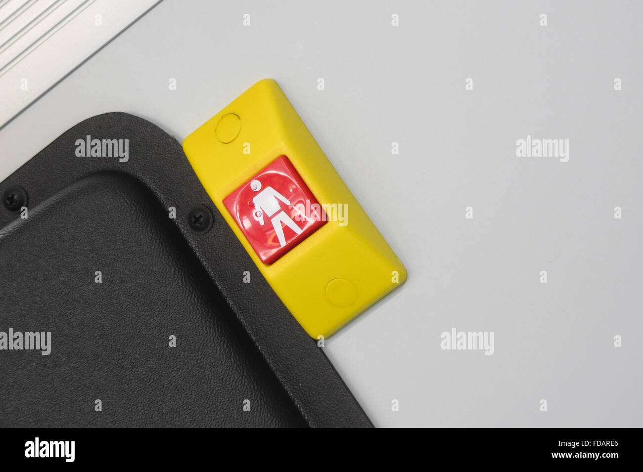 Stop on request button on bus Stock Photo - Alamy