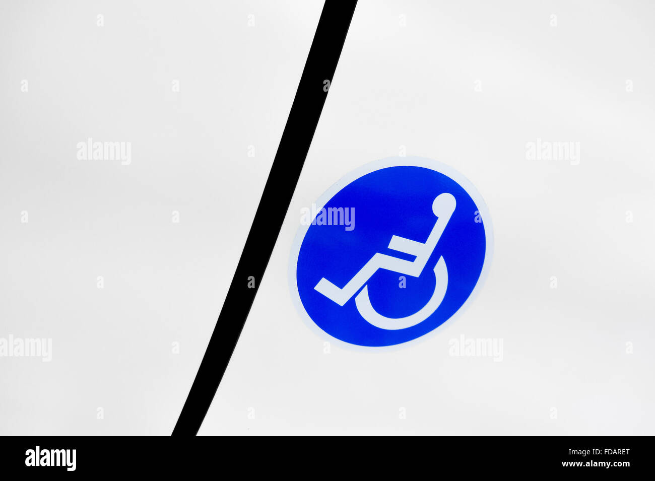 reserved seat label onboard bus for disabled people Stock Photo - Alamy