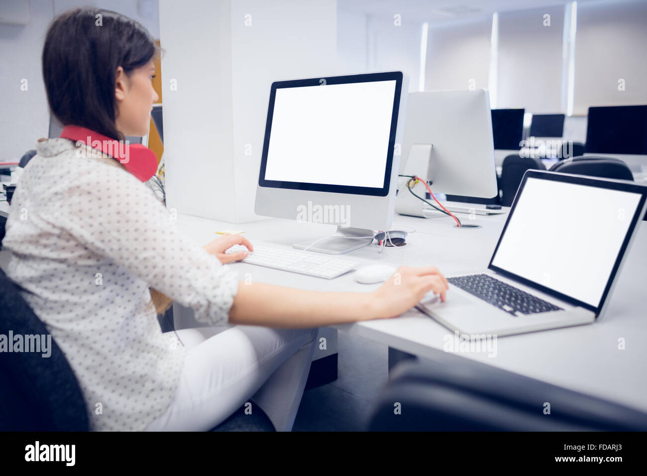 Rear view of student using computer Stock Photo - Alamy