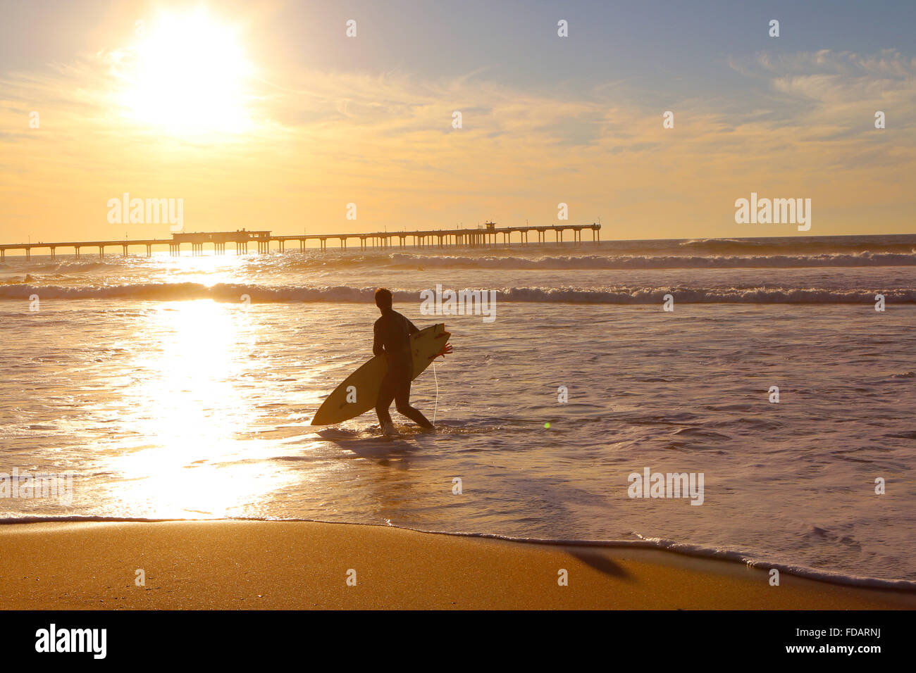 Surfer in the Sunset Stock Photo - Alamy