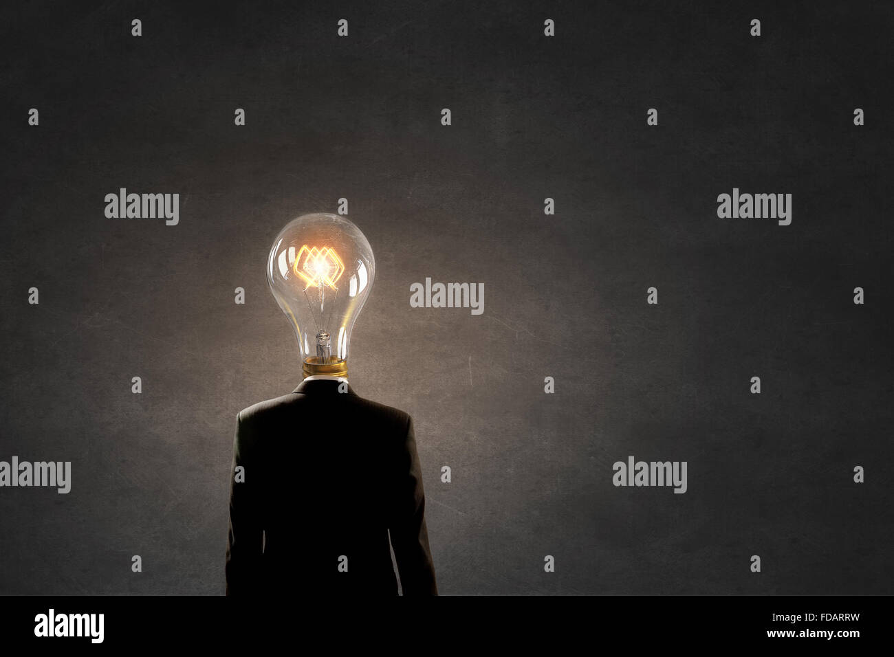 Businessman in suit with light bulb instead of head Stock Photo - Alamy