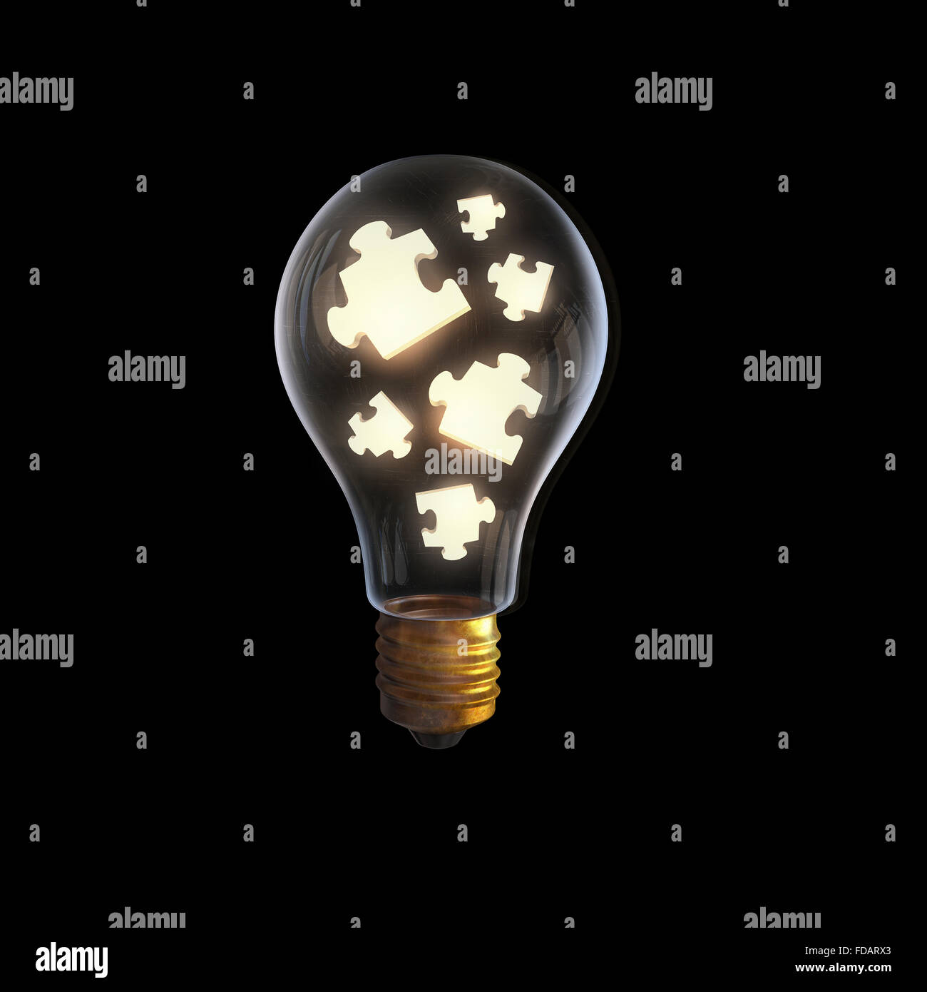 Glass light bulb with puzzle elements inside Stock Photo - Alamy