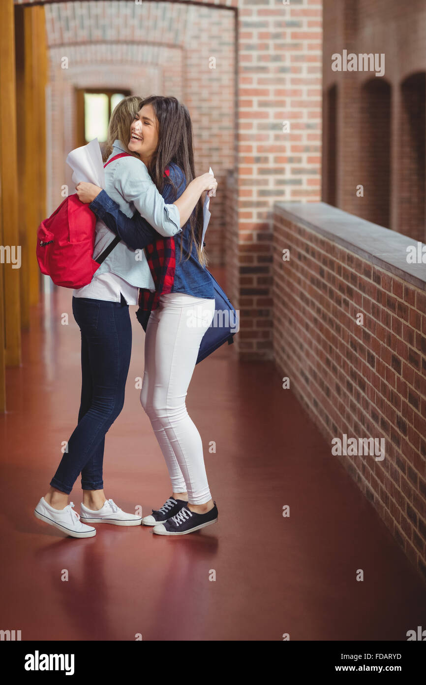 Happy students hugging after receiving results Stock Photo - Alamy