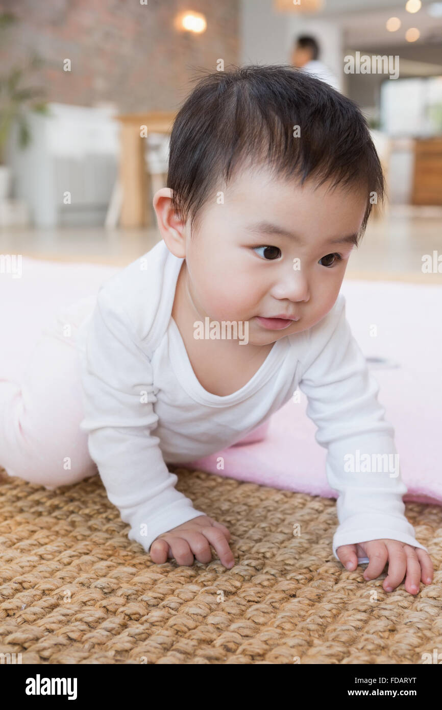 Cute baby on the carpet Stock Photo - Alamy
