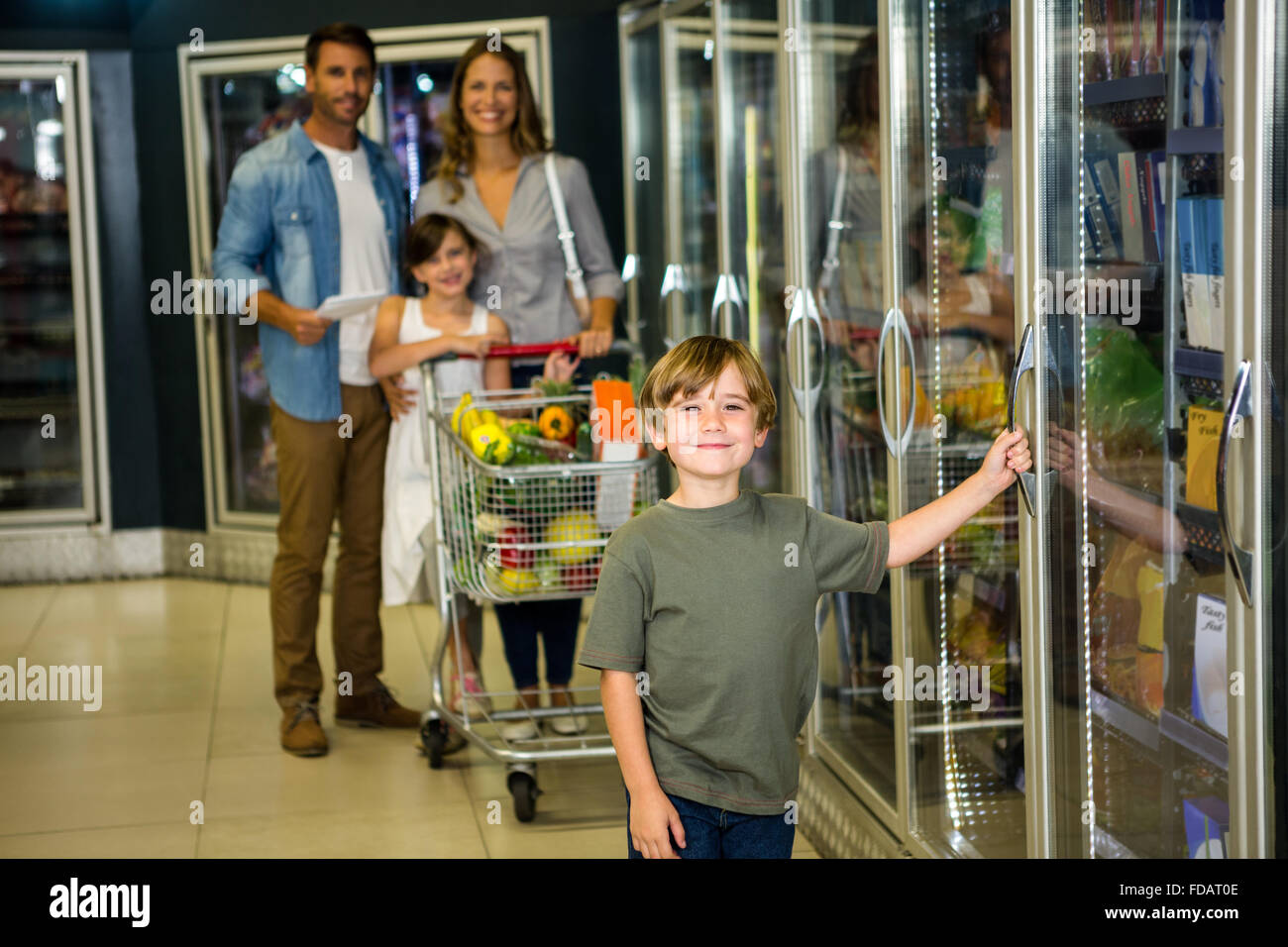 Cute family doing grocery shopping together Stock Photo - Alamy