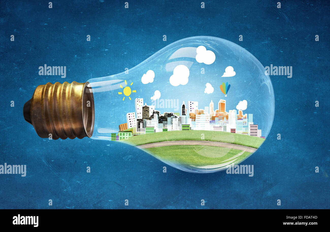 Think green concept with cityscape inside of light bulb Stock Photo - Alamy