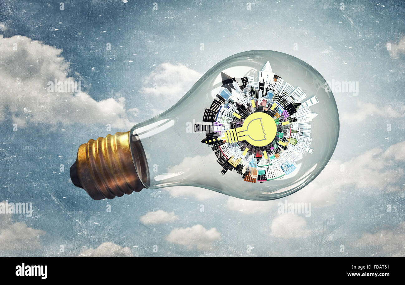 Think green concept with cityscape inside of light bulb Stock Photo - Alamy
