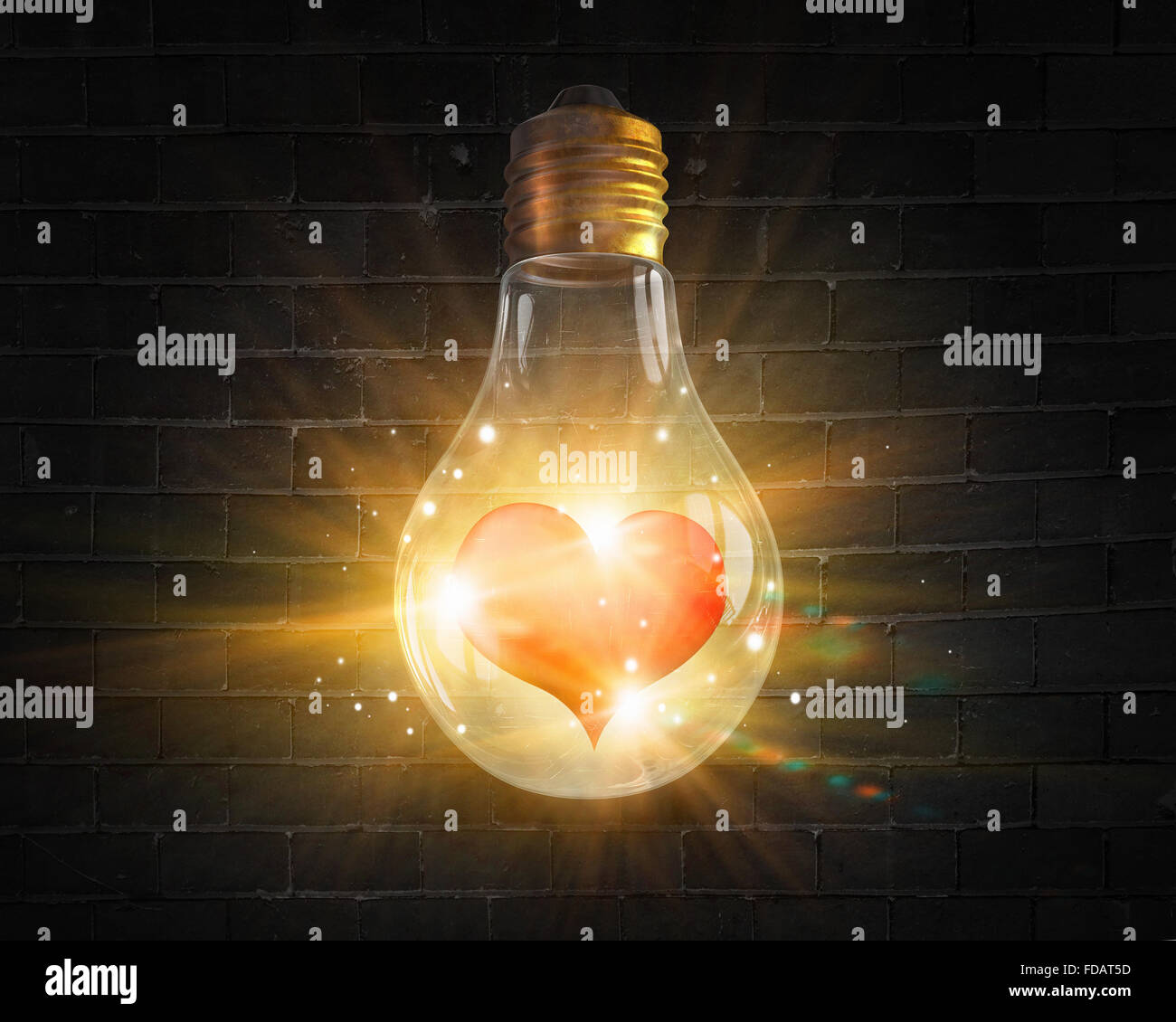 Glowing light bulb and red heart inside of it Stock Photo - Alamy