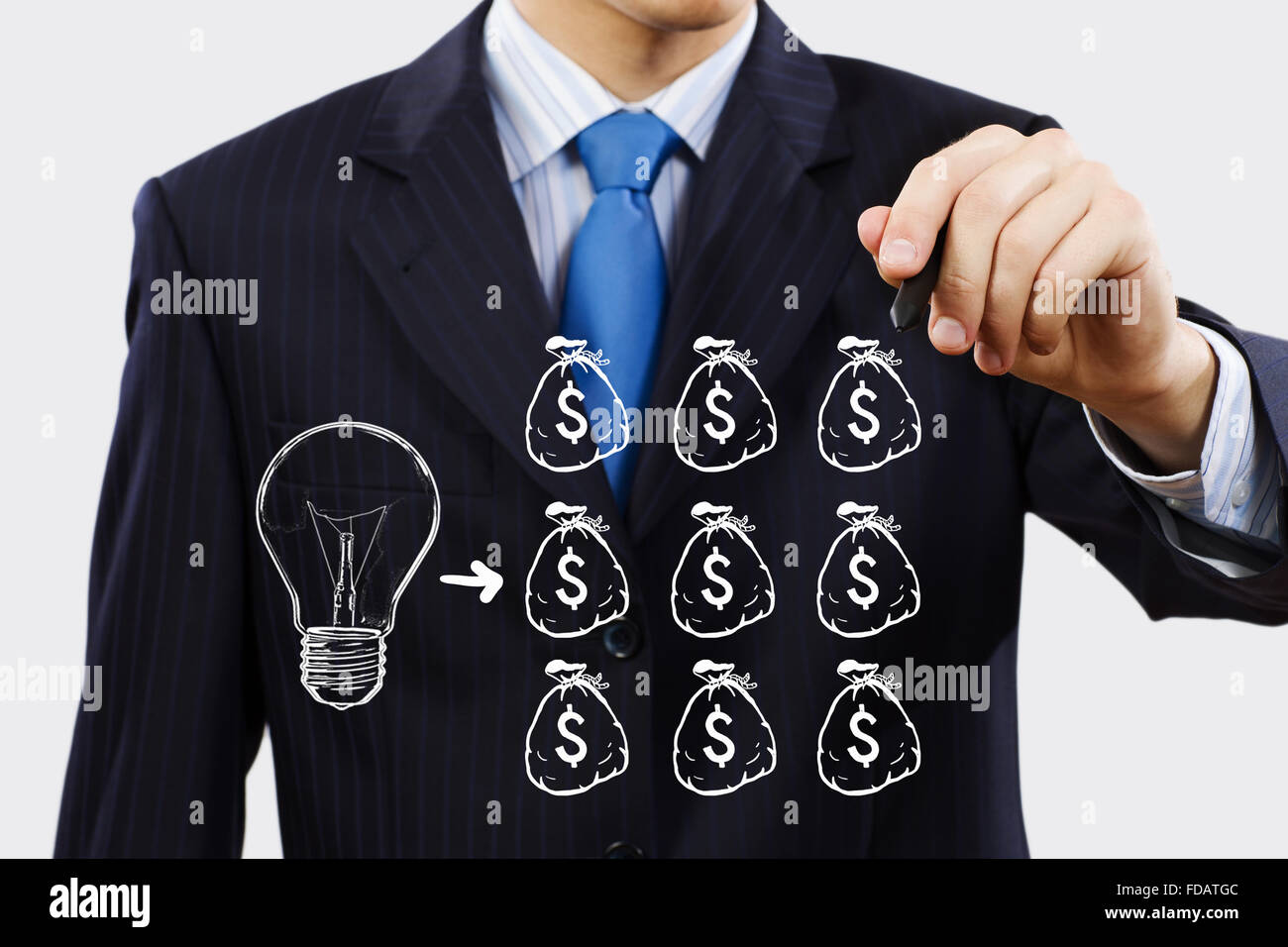Close up of businessman drawing money making formula Stock Photo - Alamy