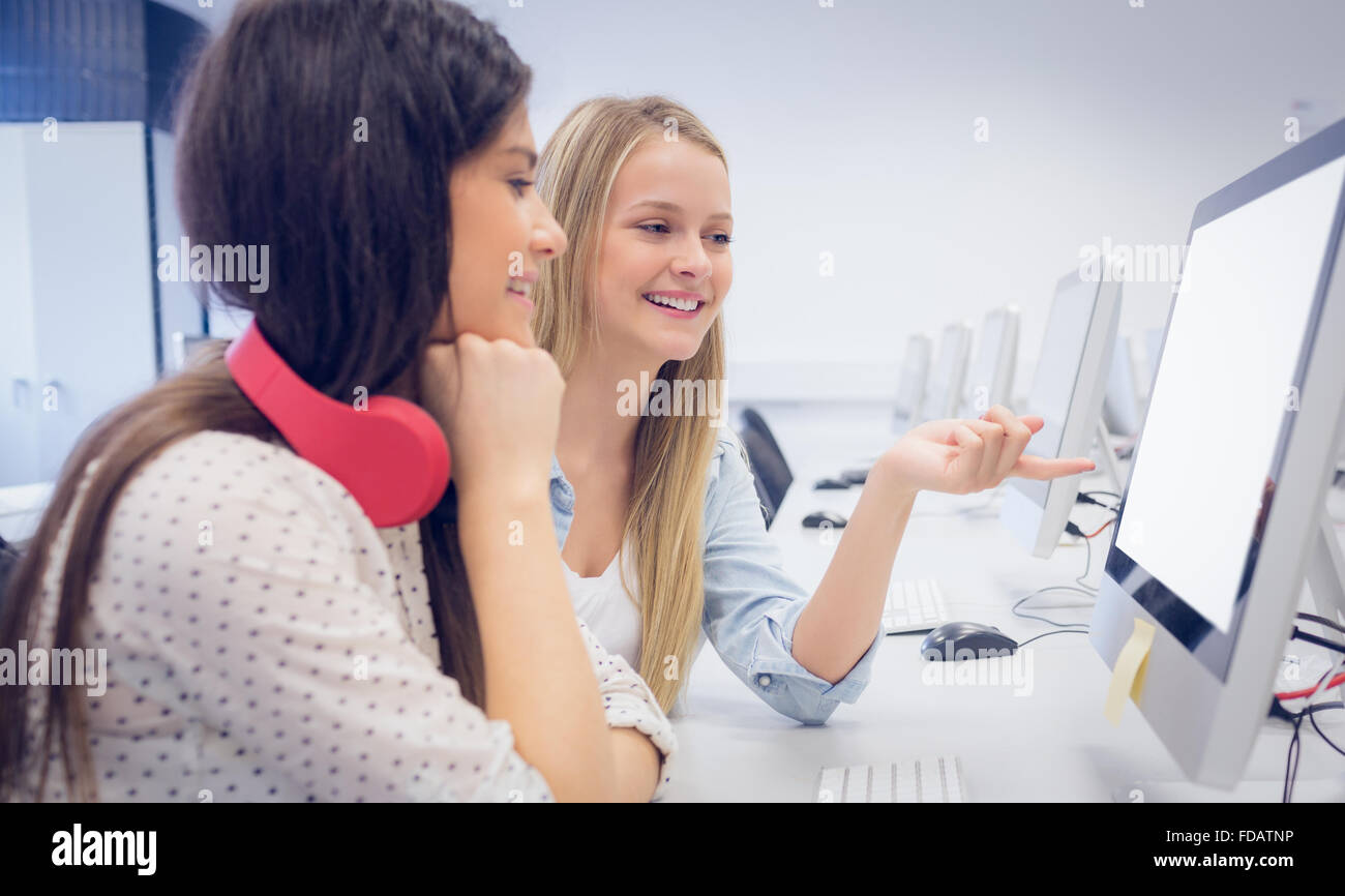 Smiling students using computer Stock Photo - Alamy