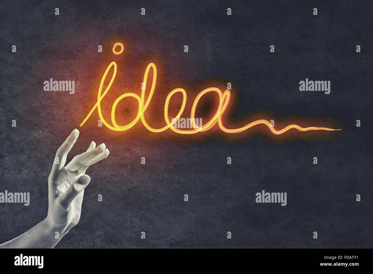 Person hand touching with fingers glowing idea word Stock Photo - Alamy