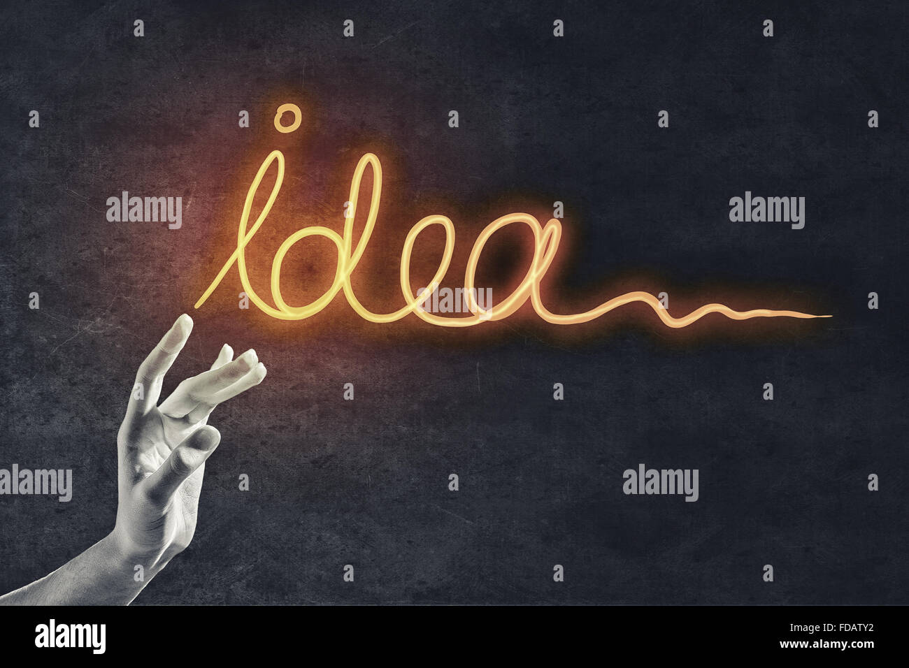 Person hand touching with fingers glowing idea word Stock Photo - Alamy