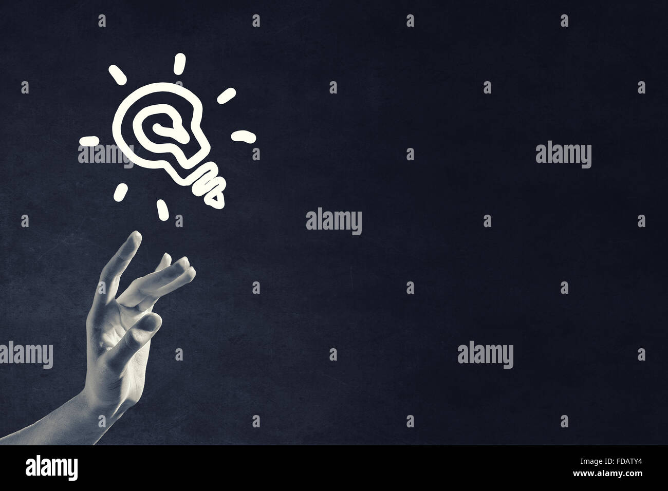 Human hand and light bulb drawn with chalk Stock Photo - Alamy