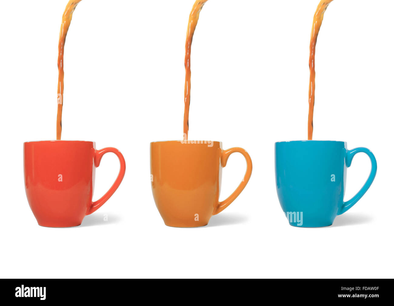 Studio shot of coffee pouring into three mugs Stock Photo - Alamy