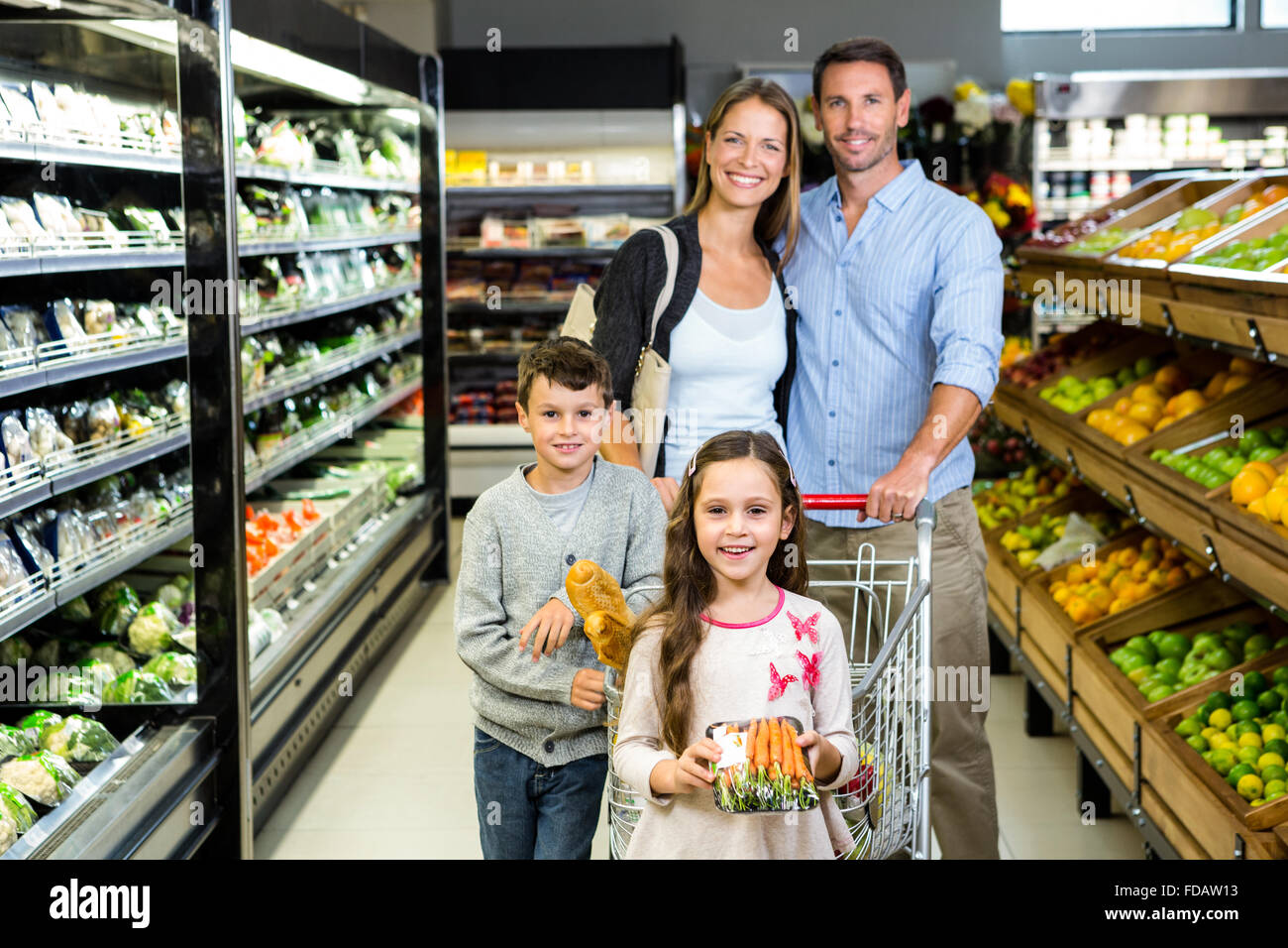 Cute family doing grocery shopping together Stock Photo - Alamy