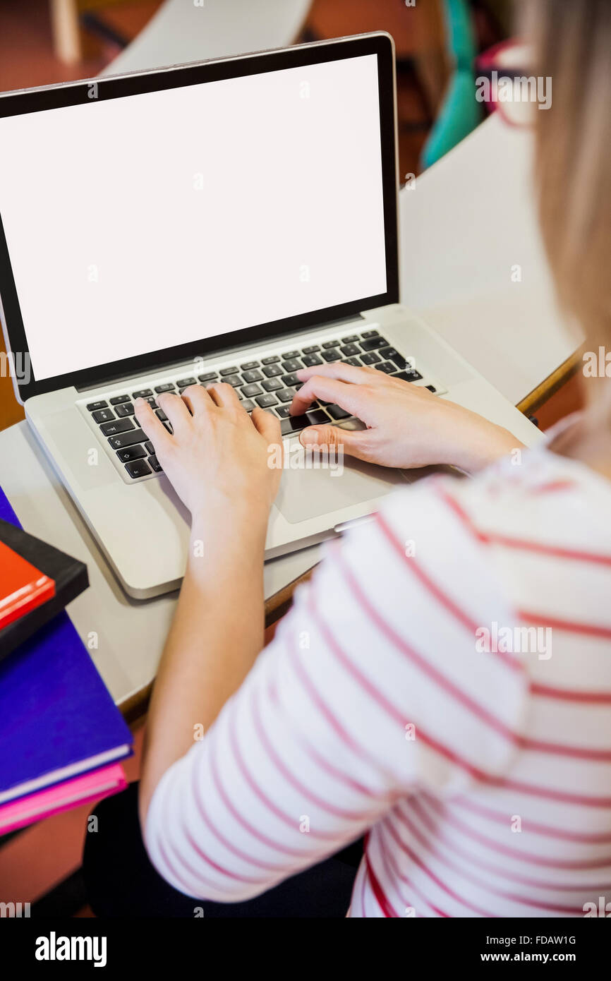 Female student typing on laptop Stock Photo - Alamy