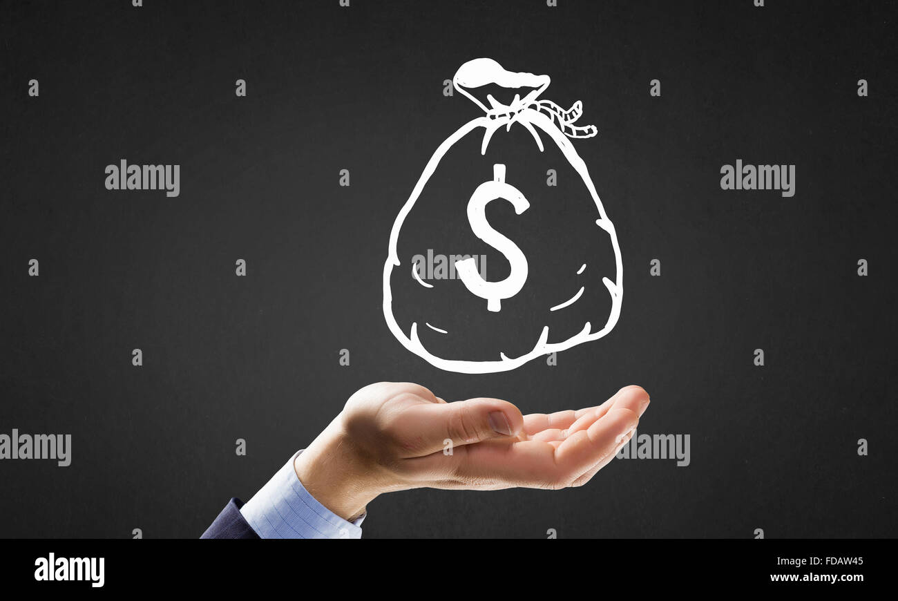 Businessman hand holding drawn money bag in palm Stock Photo - Alamy