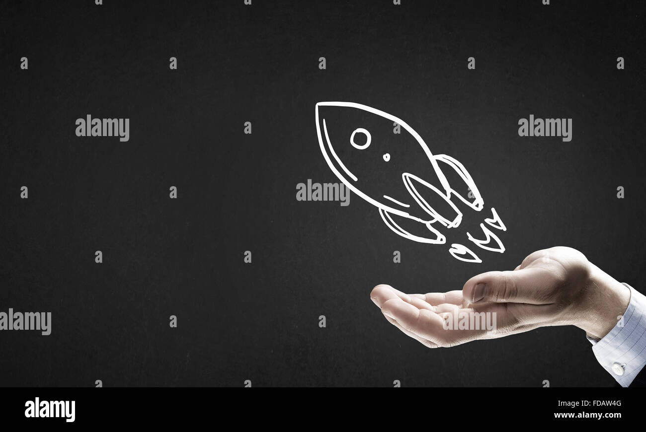 Human hand showing in palm drawn rocket sign Stock Photo - Alamy