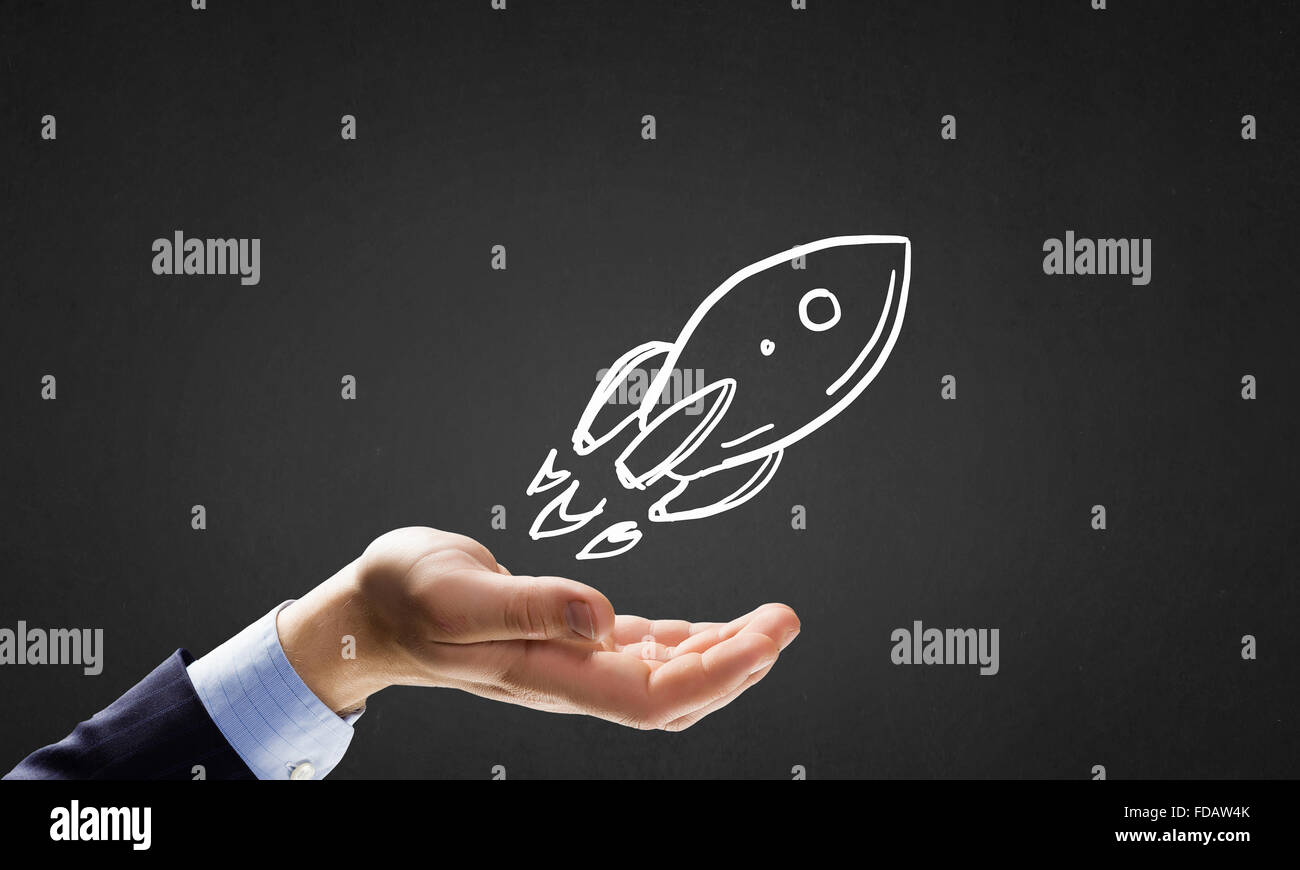 Human hand showing in palm drawn rocket sign Stock Photo - Alamy