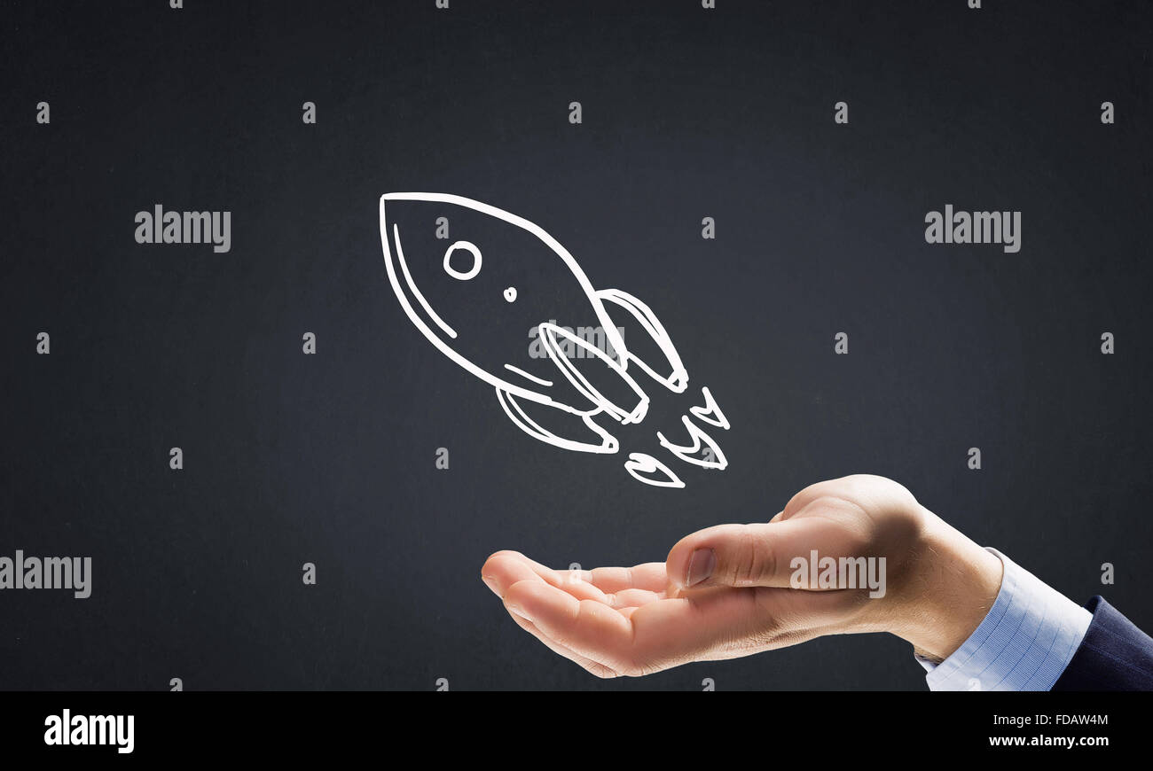 Human hand showing in palm drawn rocket sign Stock Photo - Alamy