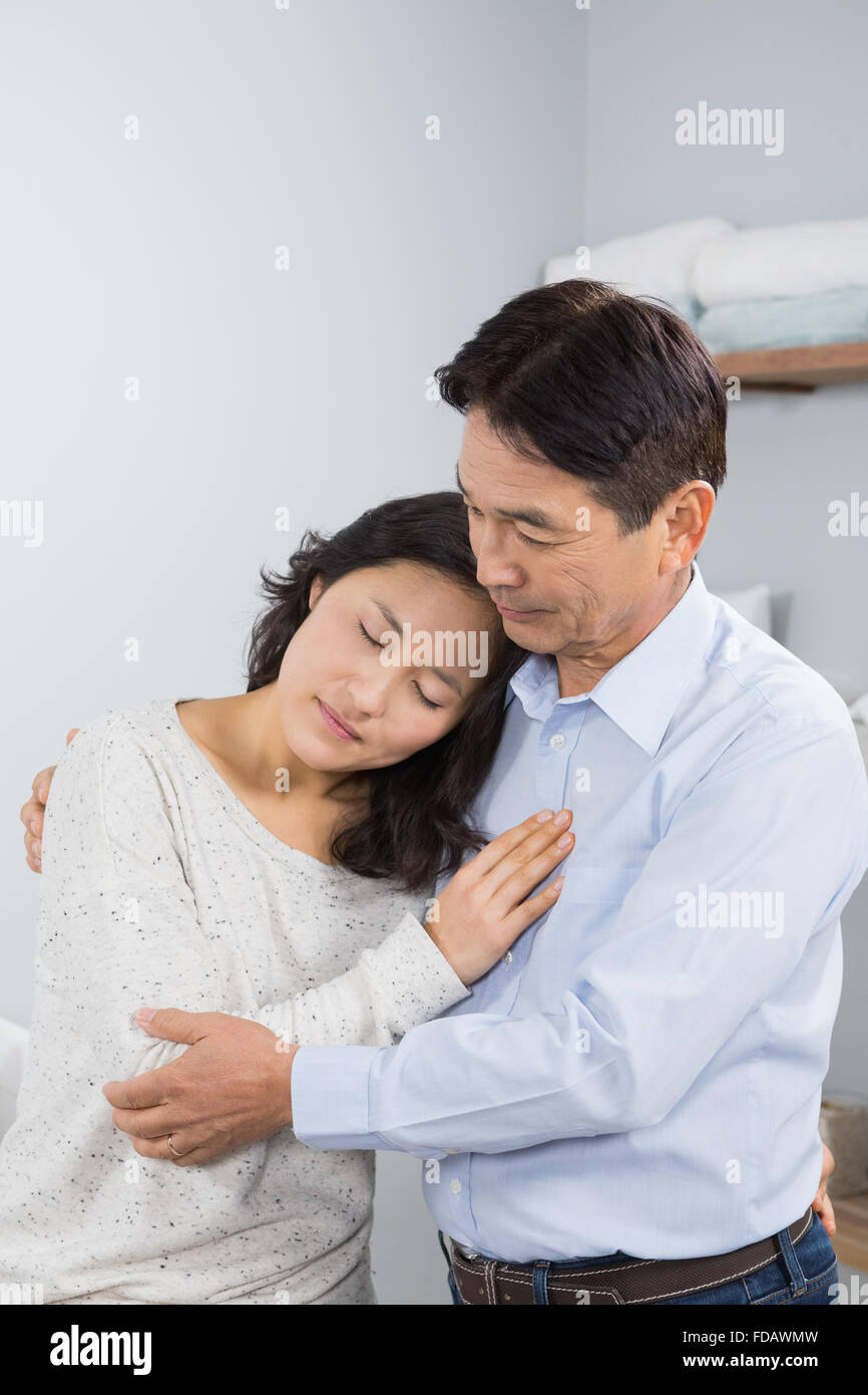 Sad couple embracing Stock Photo - Alamy