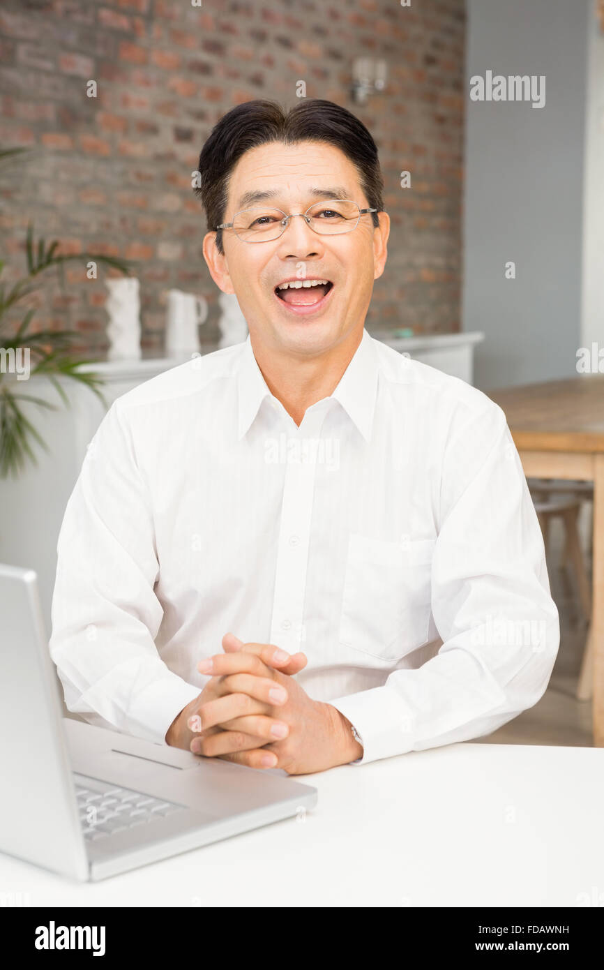Smiling man using laptop Stock Photo - Alamy Smiling man using laptop Stock Photo - Alamy