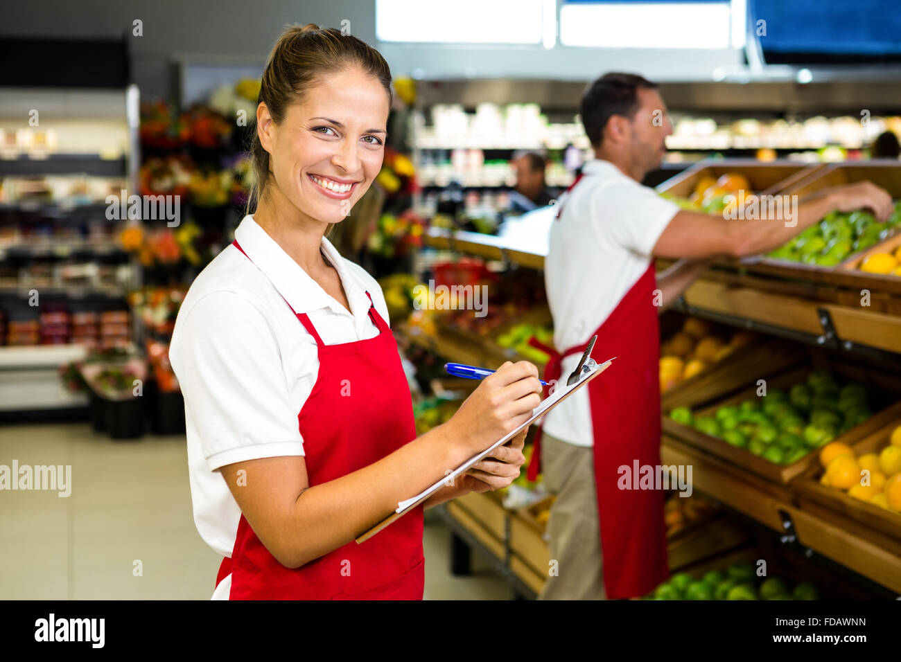 Grocery store staff with clipboard Stock Photo - Alamy