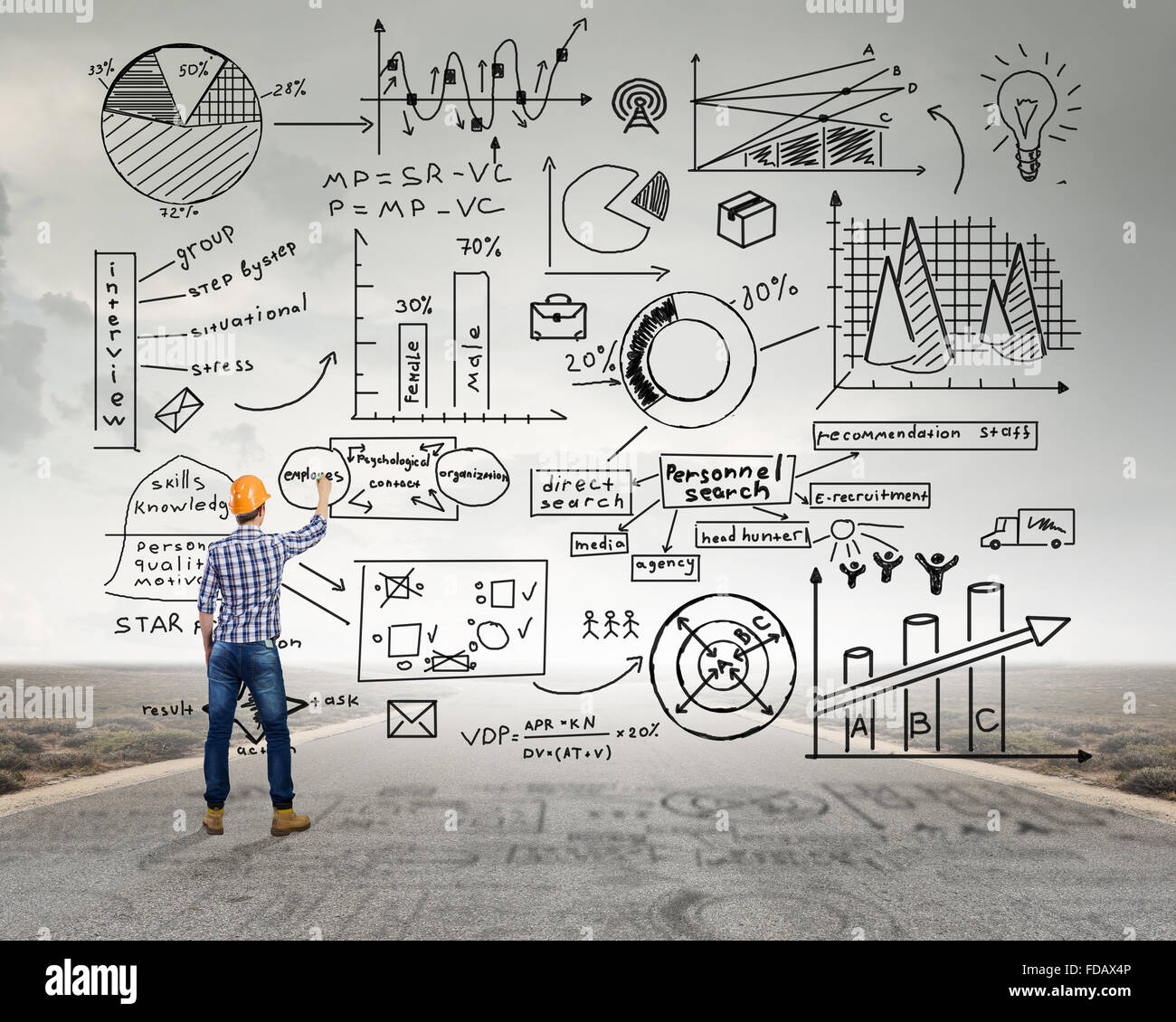 Back view of man engineer drawing plan sketches on wall Stock Photo - Alamy