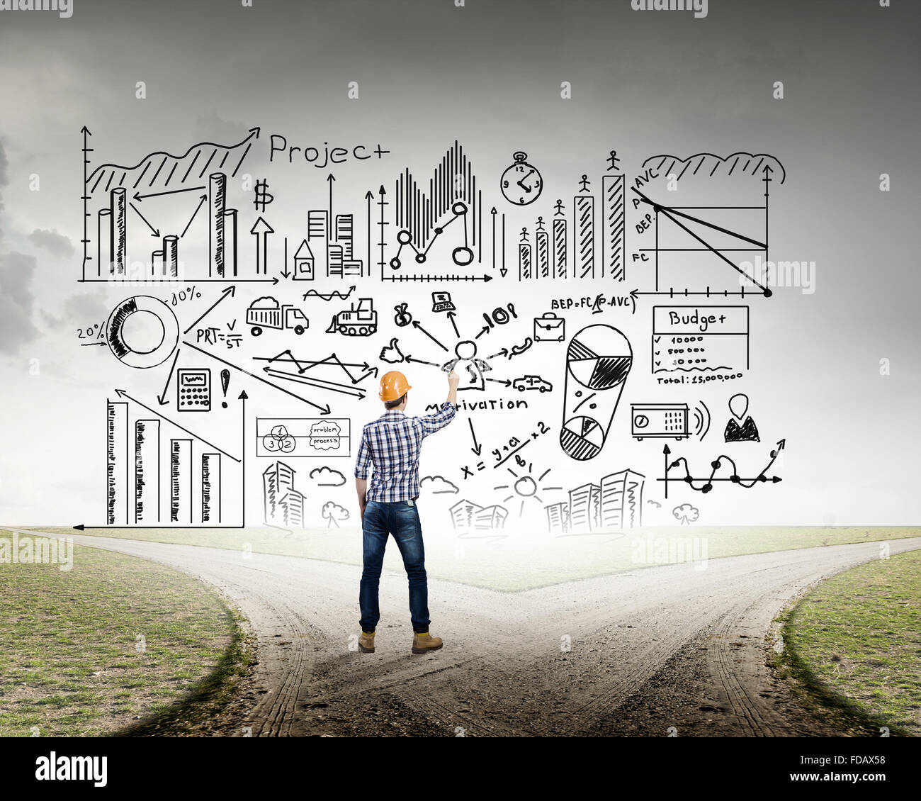 Back view of man engineer drawing plan sketches on wall Stock Photo - Alamy