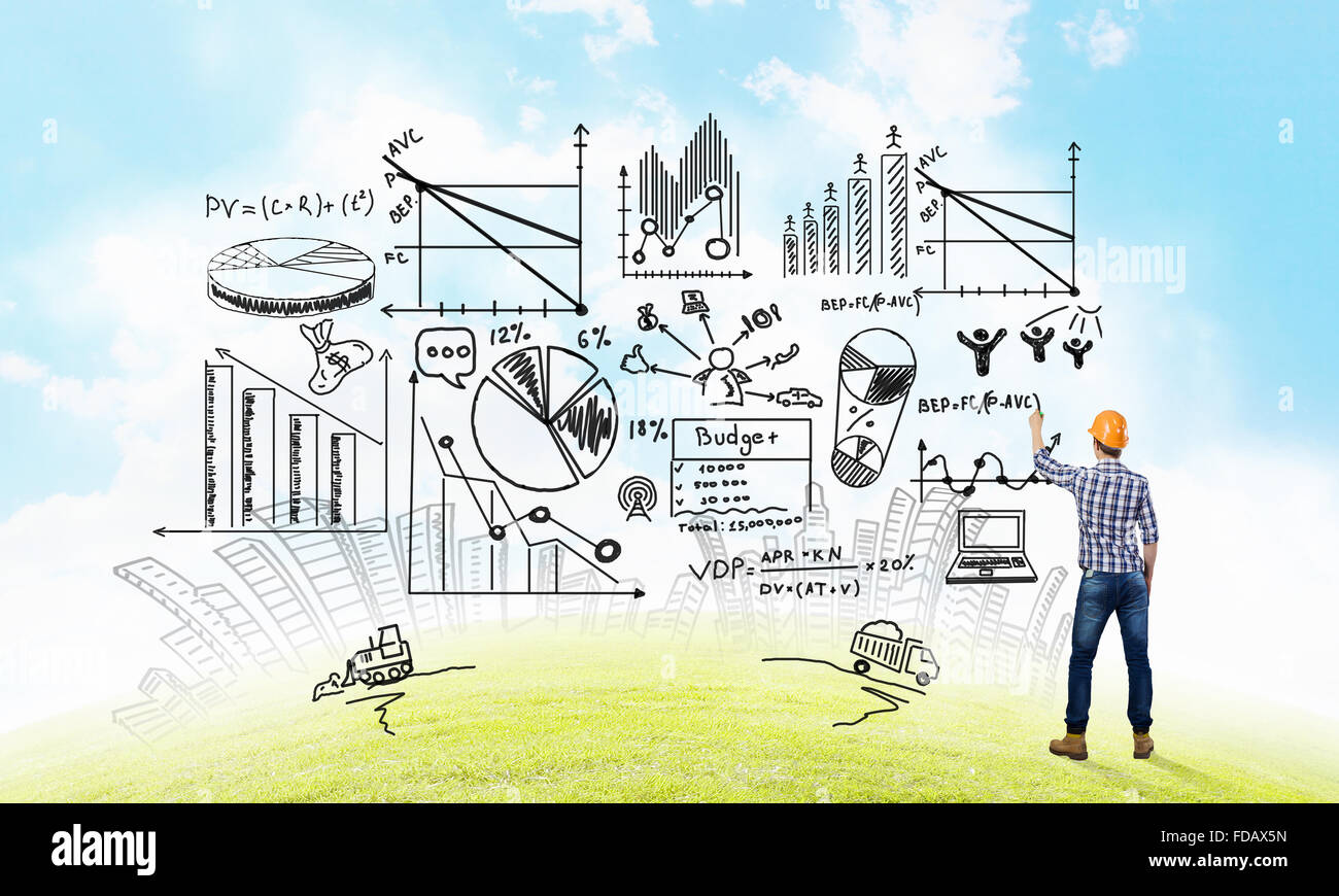 Back view of man engineer drawing plan sketches on wall Stock Photo - Alamy