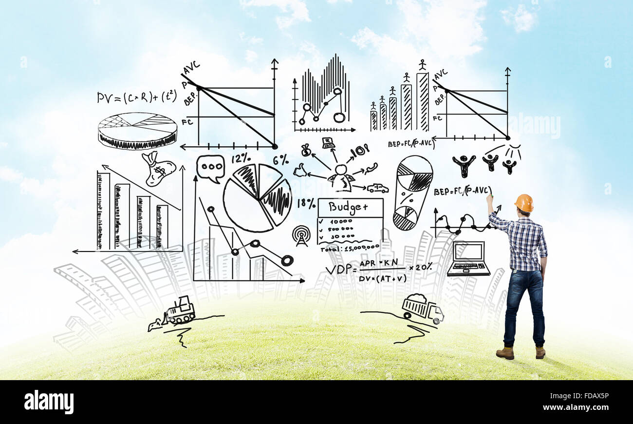 Back view of man engineer drawing plan sketches on wall Stock Photo - Alamy