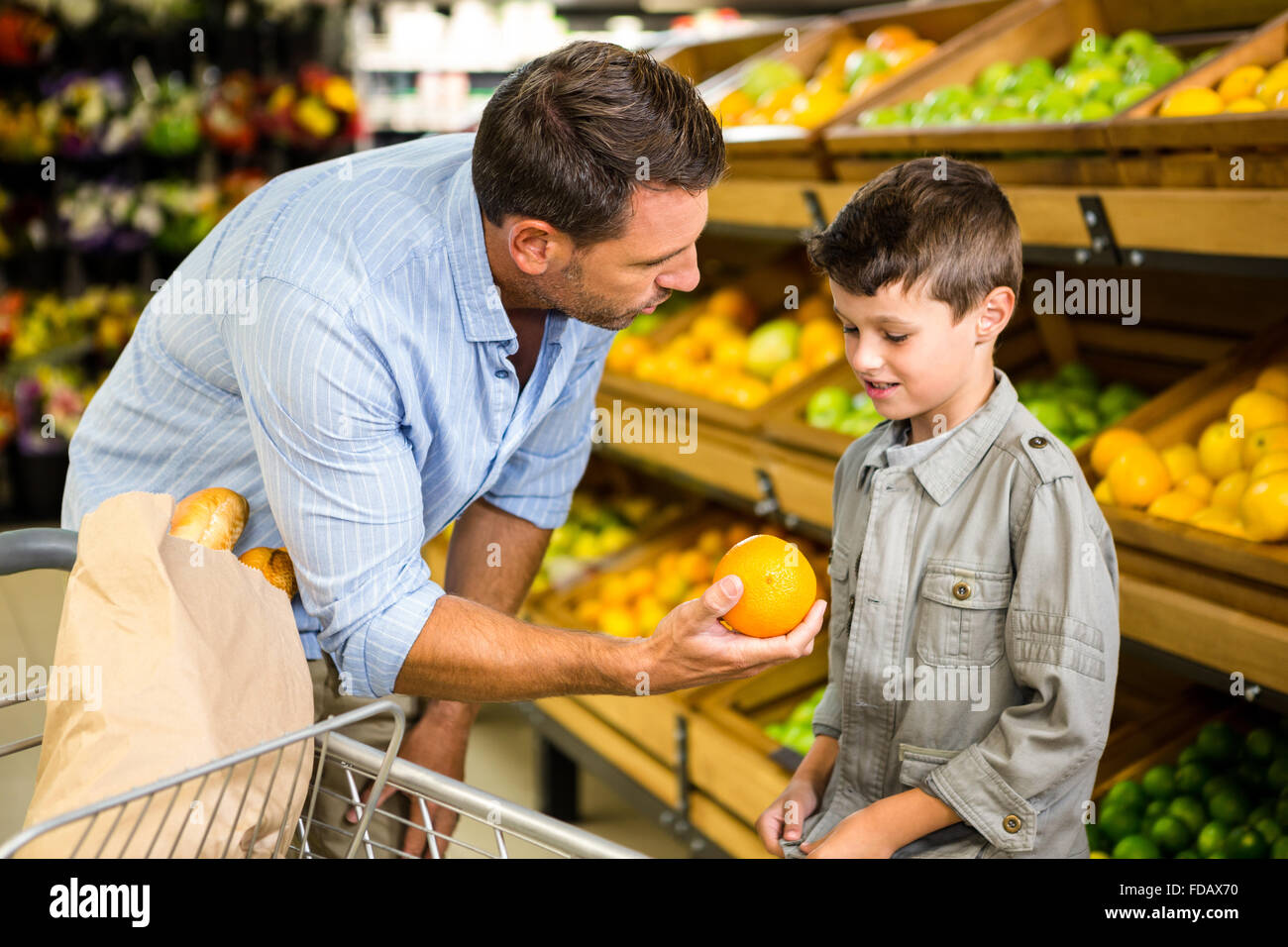 Father and son doing grocery shopping Stock Photo - Alamy