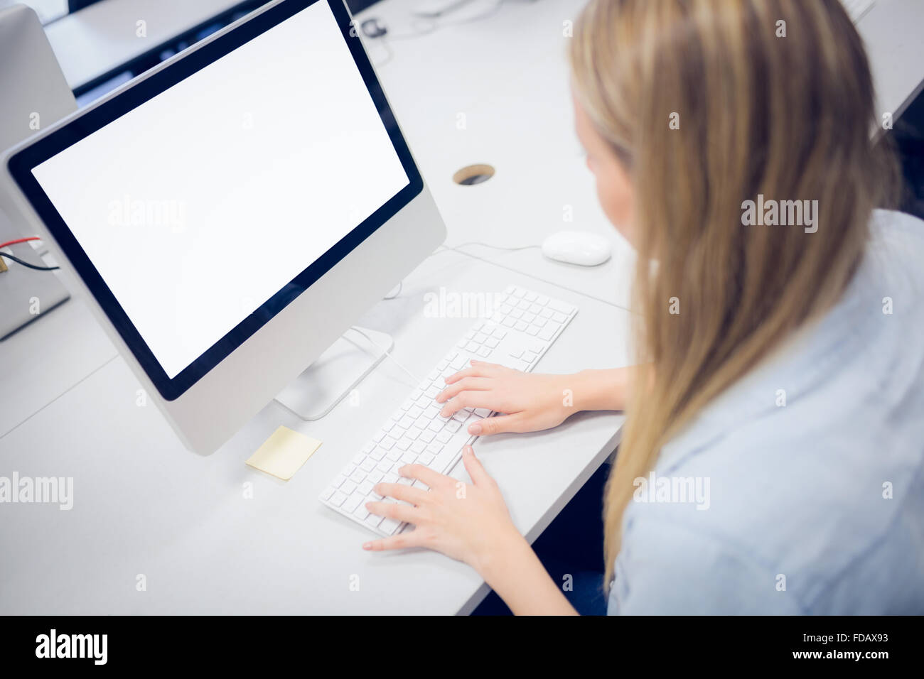 Rear view of student using computer Stock Photo - Alamy