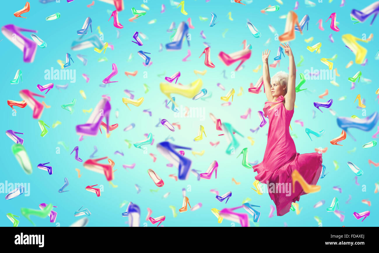 Young cheerful woman in dress and many falling shoes Stock Photo - Alamy