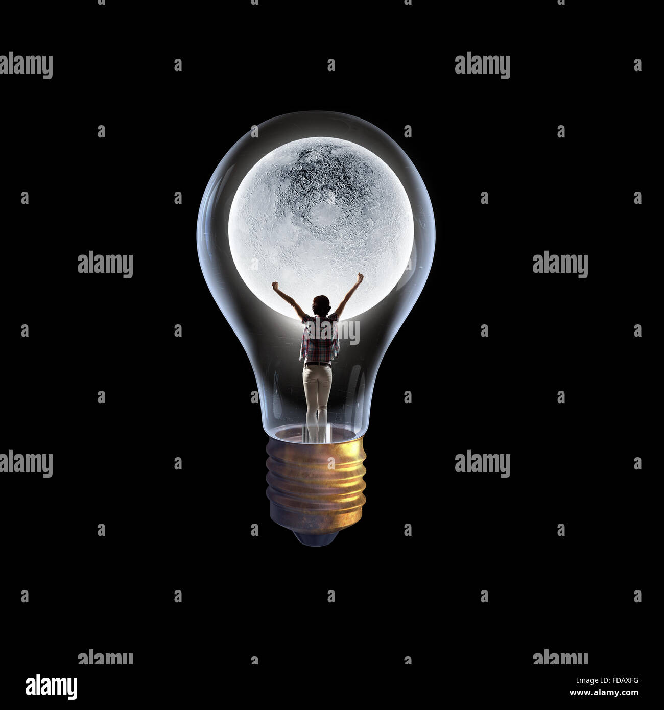 Cheerful girl inside of glass light bulb Stock Photo - Alamy