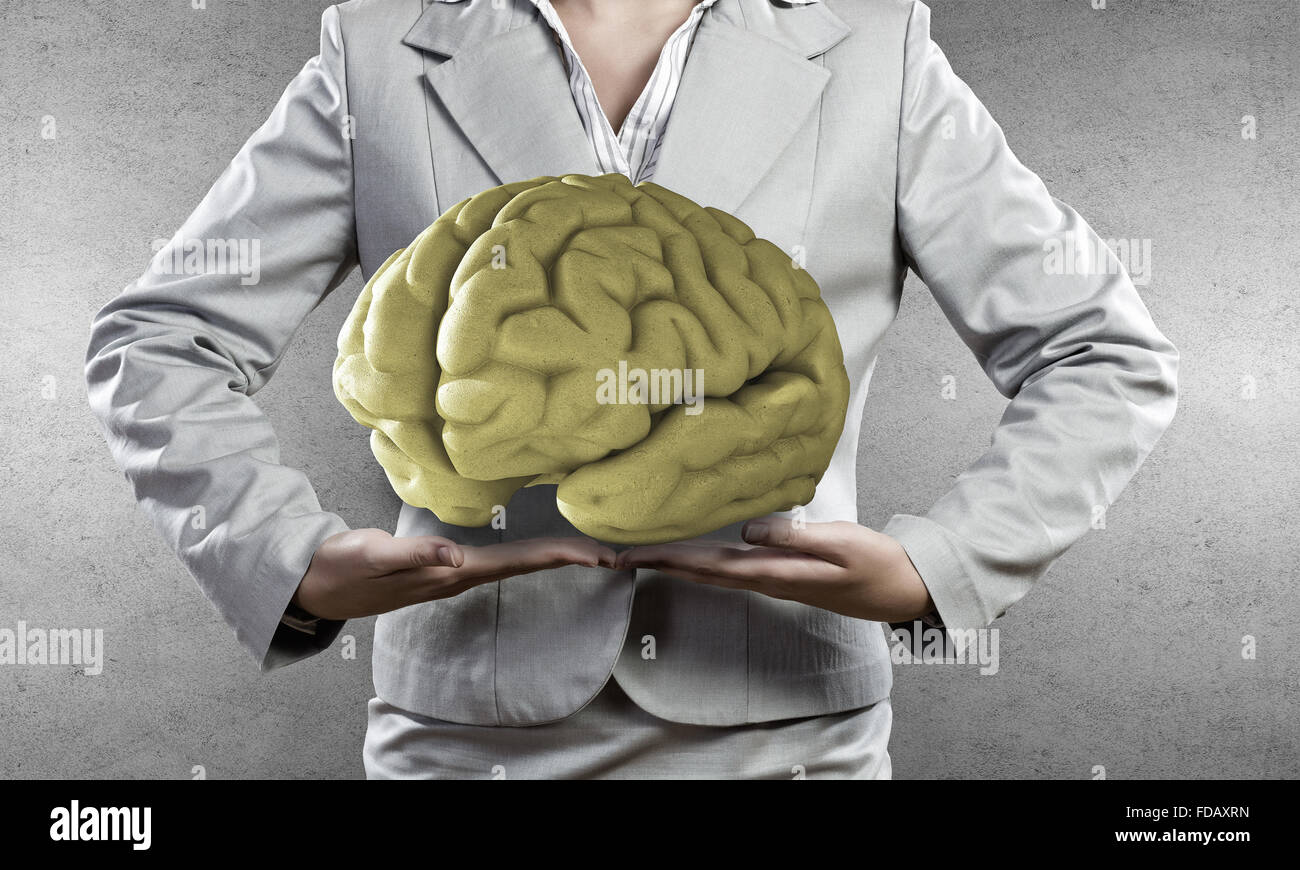 Businesswoman presenting in palms brain or save intelligence concept ...