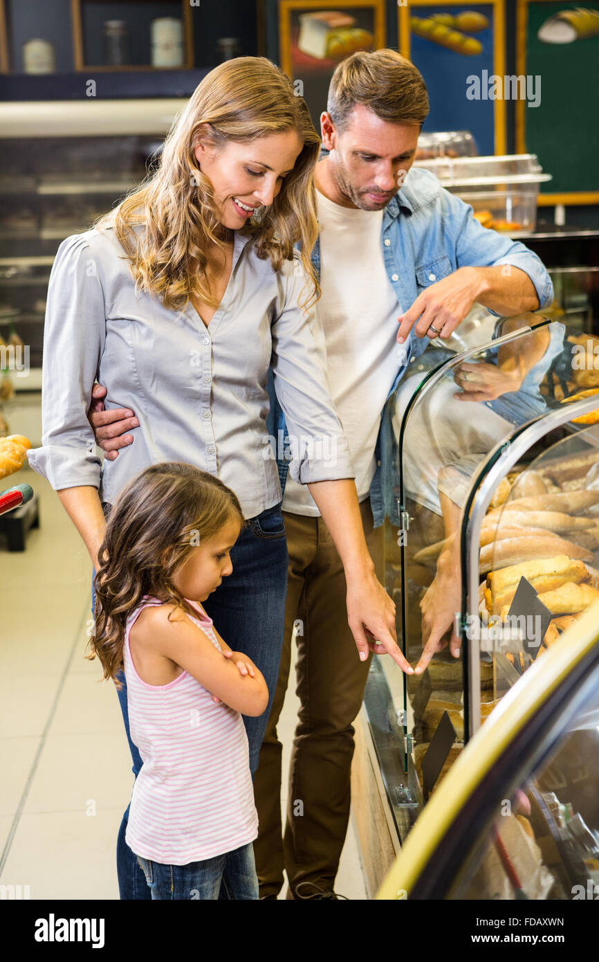 Happy family looking at bread Stock Photo - Alamy