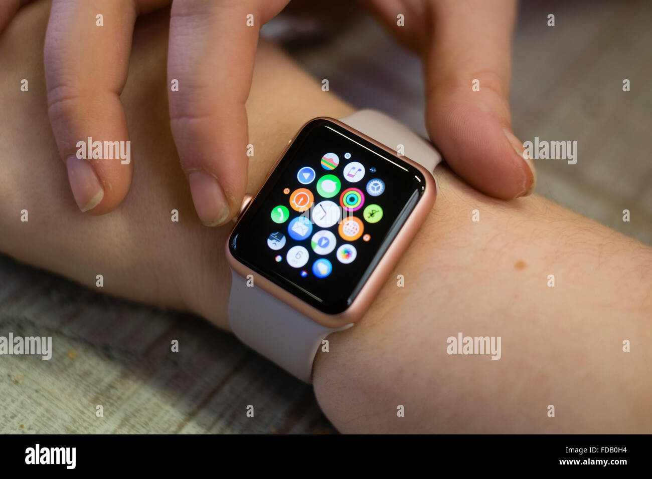 A young woman using an Apple iWatch, UK Stock Photo - Alamy