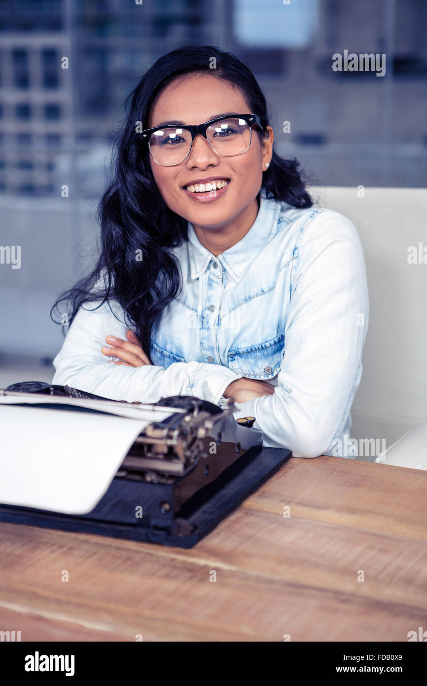 Asian woman typewriting Stock Photo - Alamy