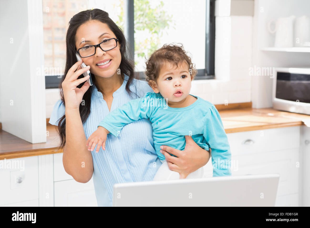 Cute baby using phone adorable hi-res stock photography and images - Alamy