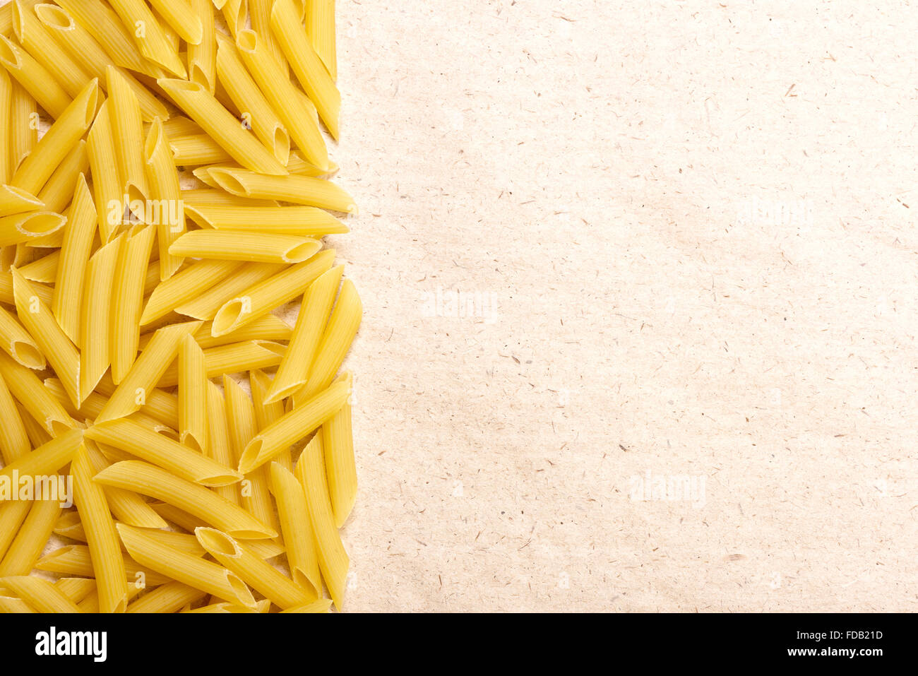 food background - pasta and rough colored paper Stock Photo - Alamy
