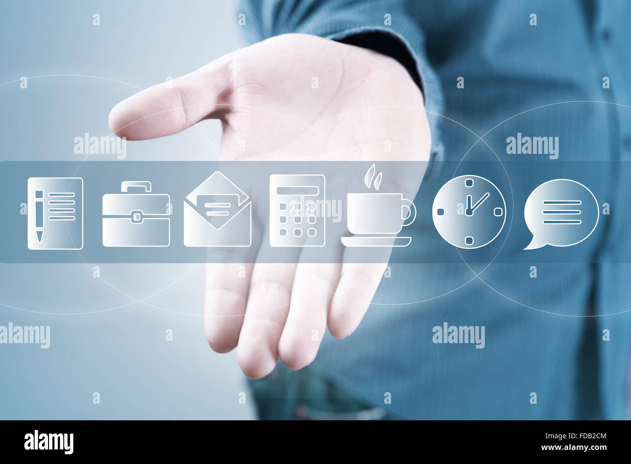 Hand of businessman presenting icons on virtual screen Stock Photo - Alamy