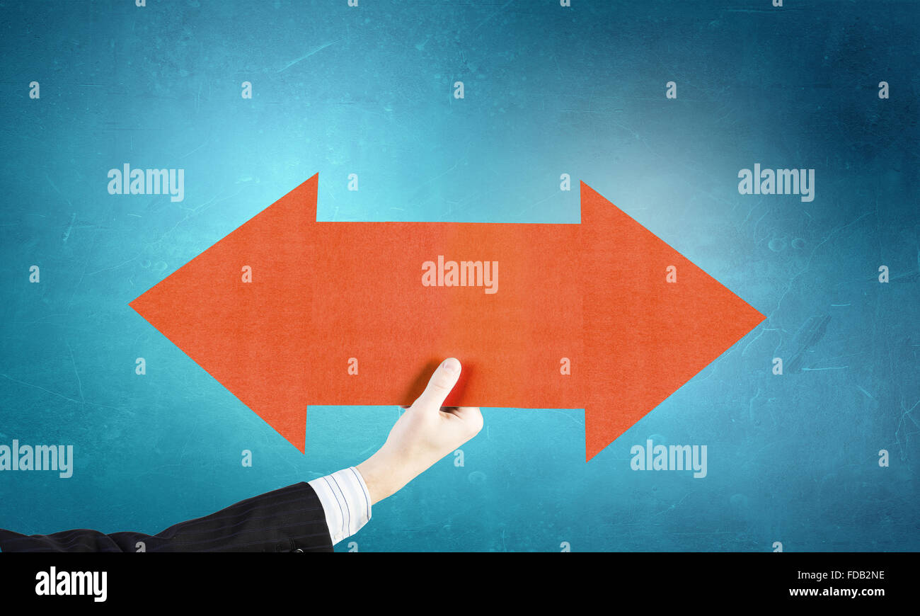 Red arrow pointing hi-res stock photography and images - Alamy