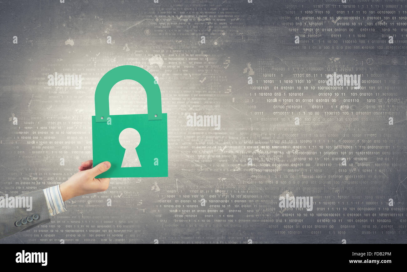 Hand of business person holding locker sign Stock Photo - Alamy