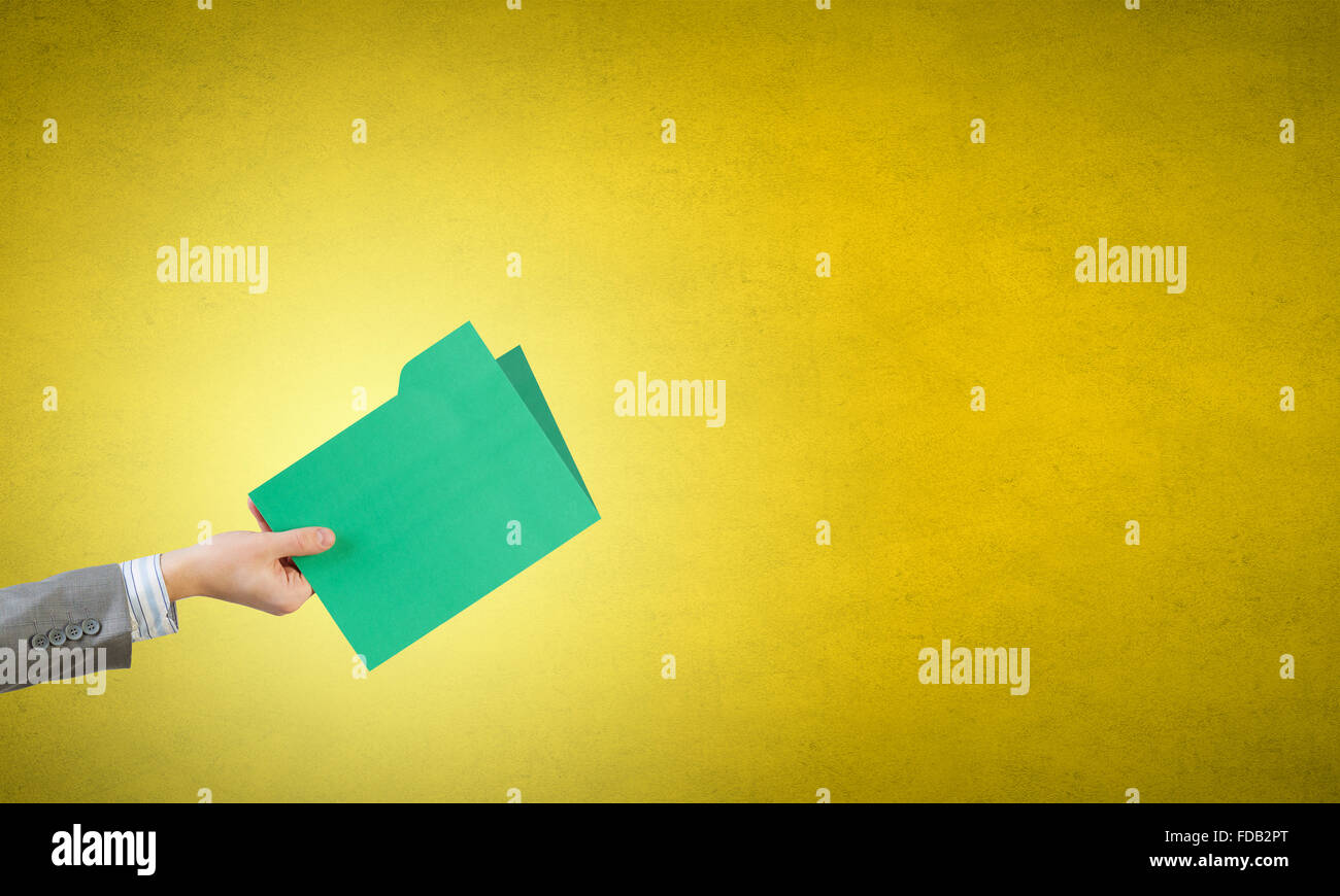 Hand of business person holding folder in raised hand Stock Photo - Alamy