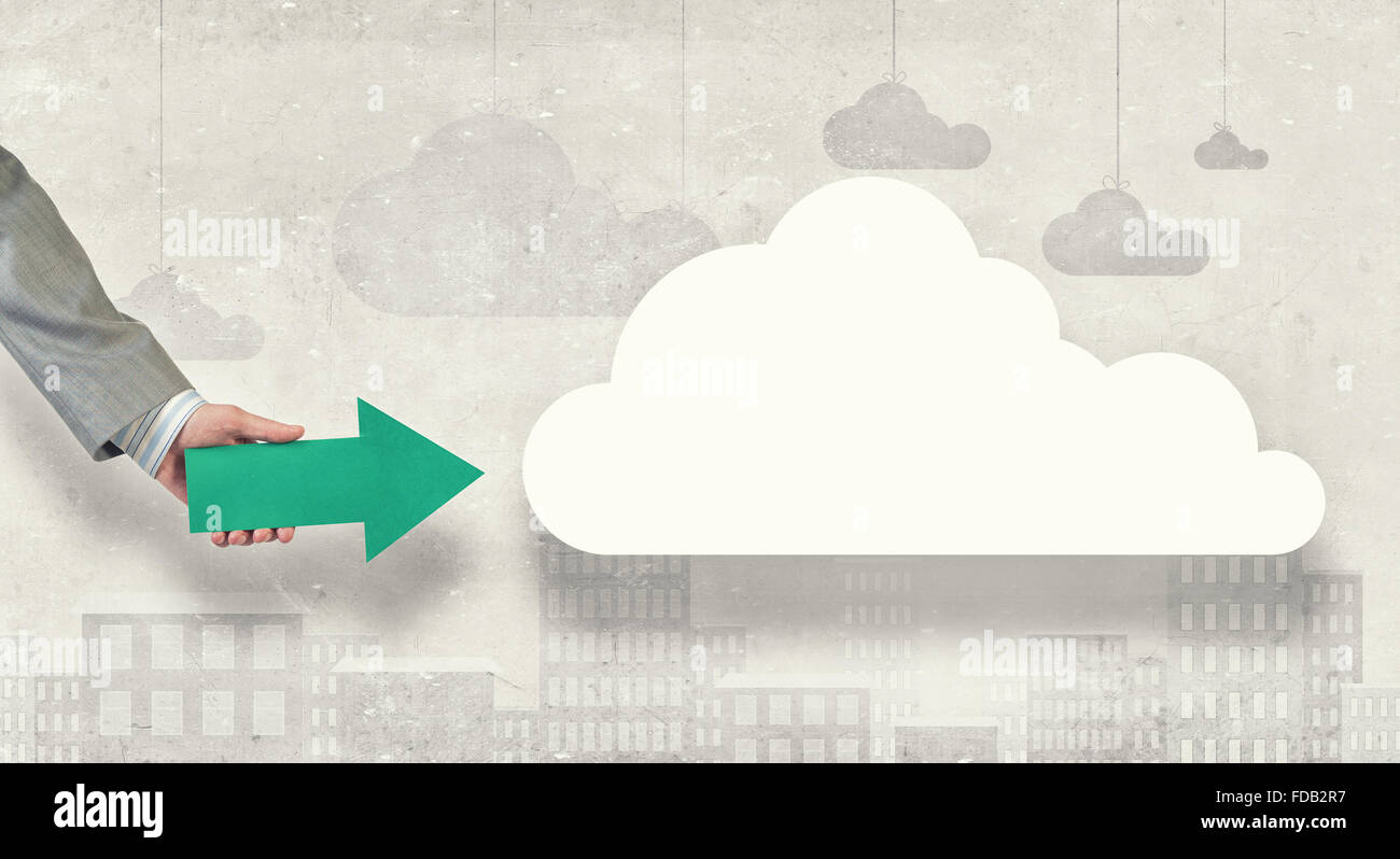 Close up of hand pointing with arrow at cloud concept Stock Photo - Alamy