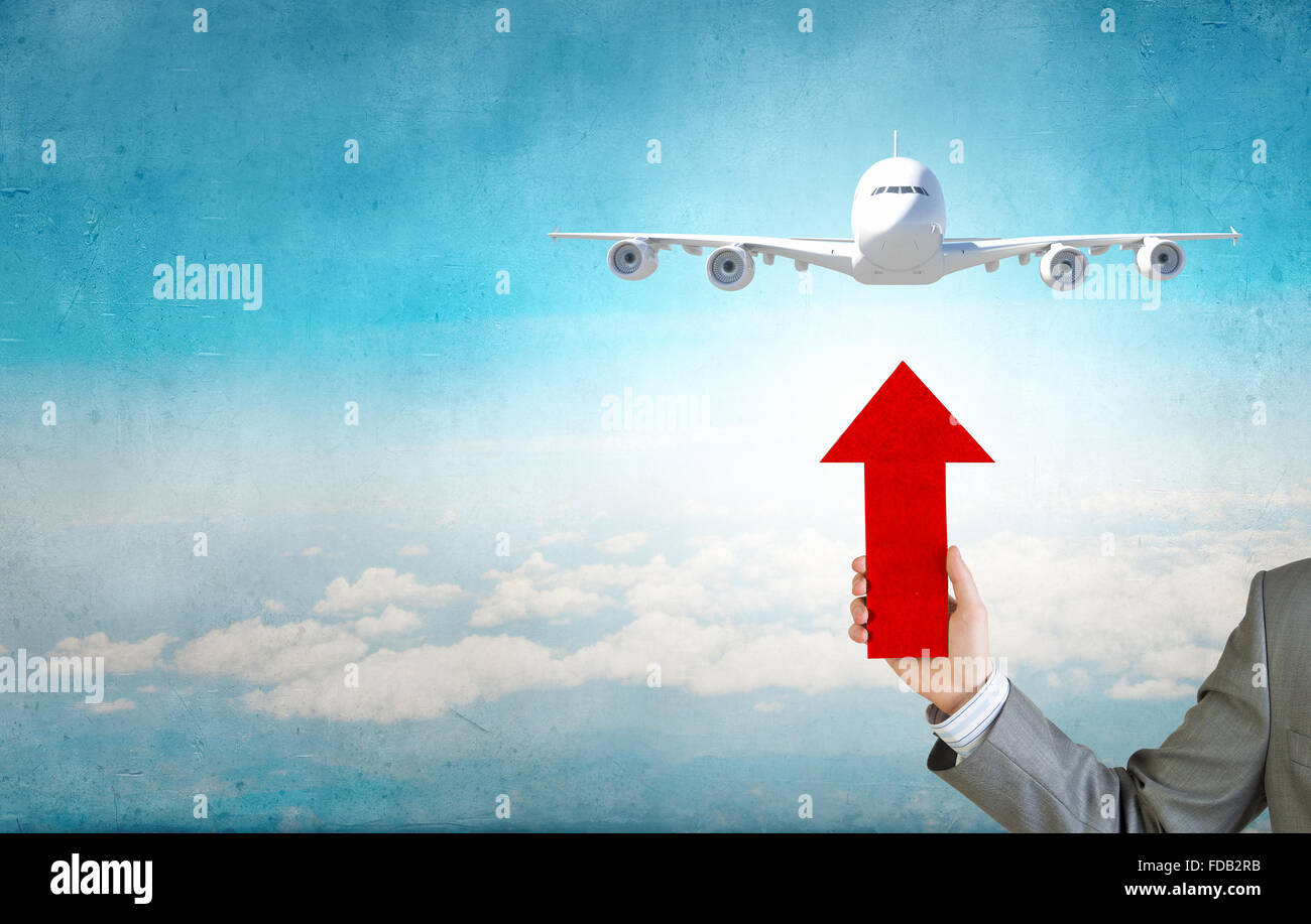 Close up of male hand pointing with arrow at airplane model Stock Photo ...