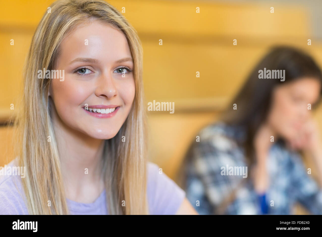 Portrait of smiling student in class Stock Photo - Alamy